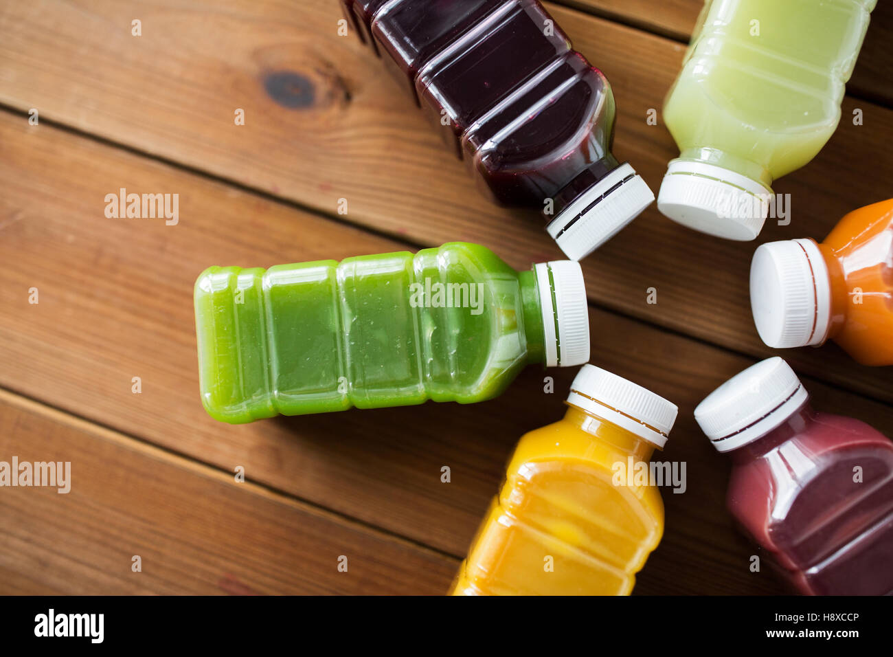 bottles with different fruit or vegetable juices Stock Photo - Alamy