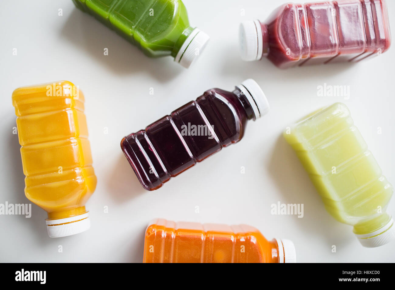 bottles with different fruit or vegetable juices Stock Photo - Alamy
