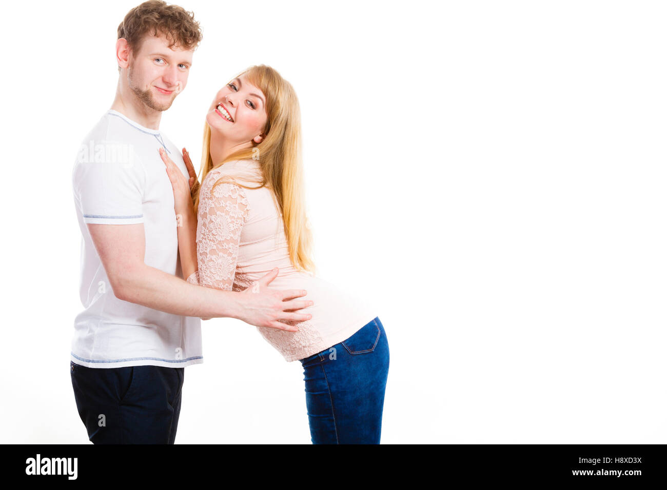 Love is everywhere. Enamoured cheerful couple in hug. Cuddling lovers ...