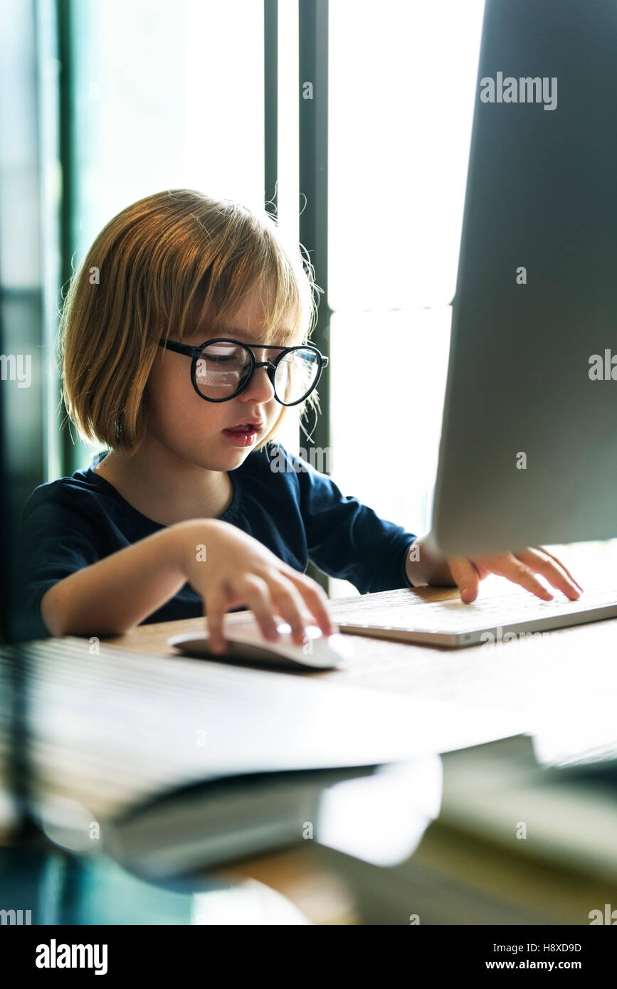 Kid Surfing Computer Internet Lifestyle Concept Stock Photo - Alamy