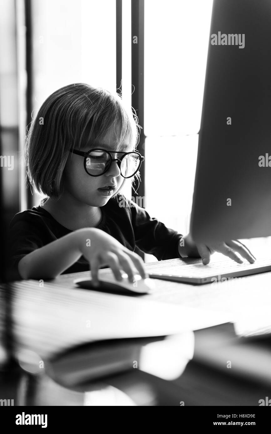 Little girl using desktop computer Black and White Stock Photos ...