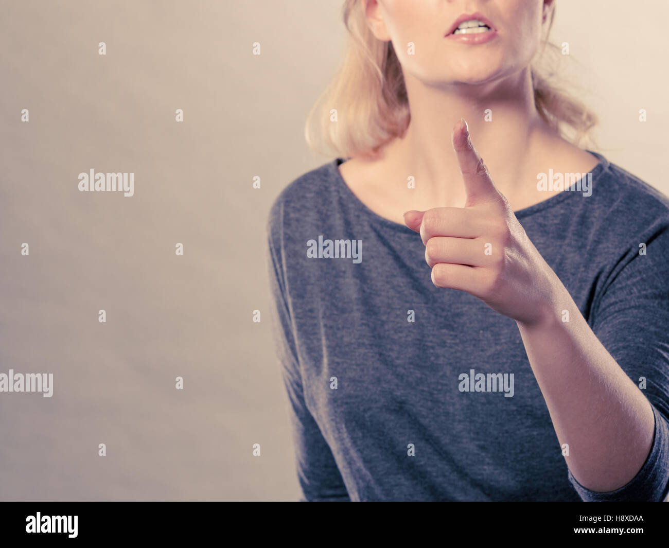 Anger and rage concept. Young expressive woman show her bad face. Angry ...