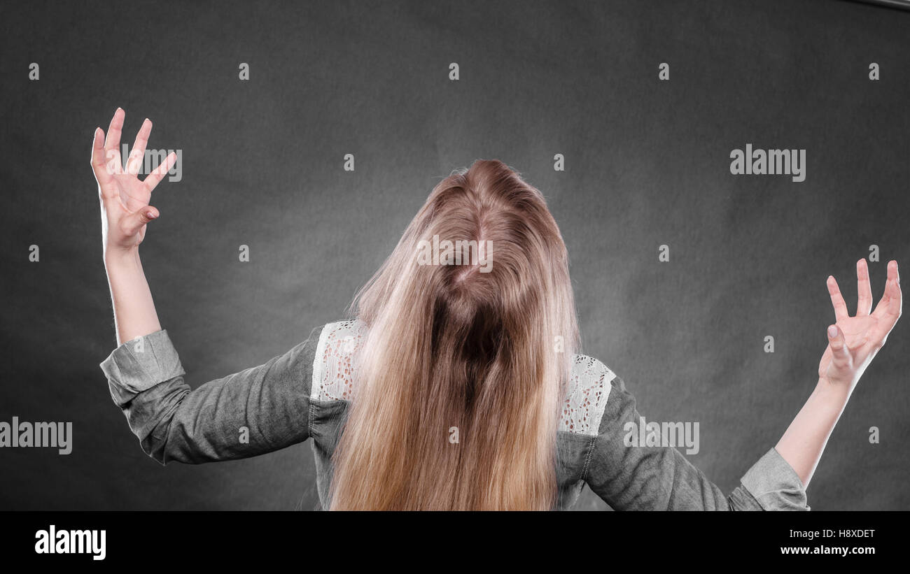 Fury and big anger inside of people. Blonde furious woman making hands ...
