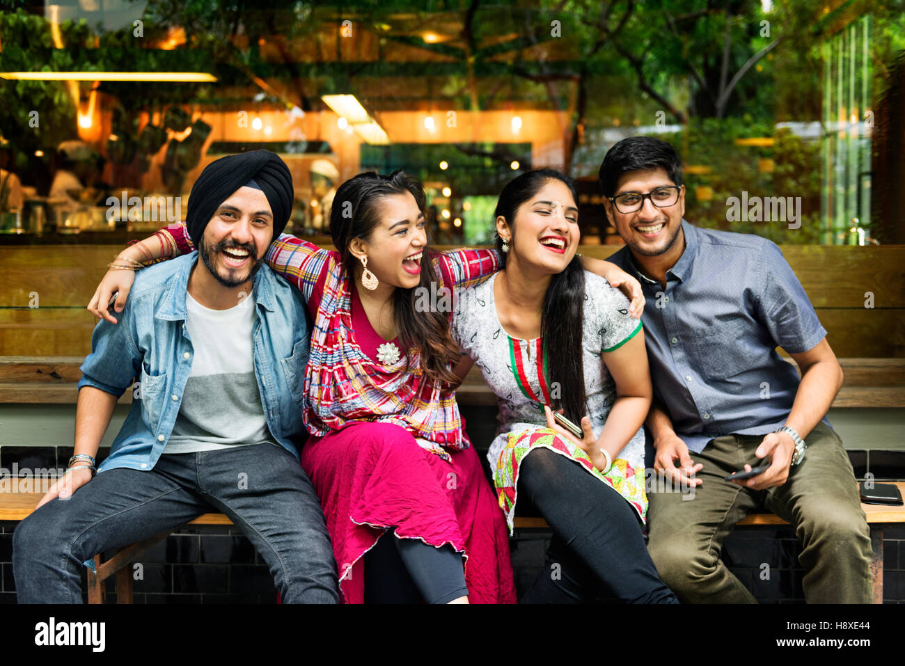 Friends Sitting Chilling Cheerful Concept Stock Photo - Alamy