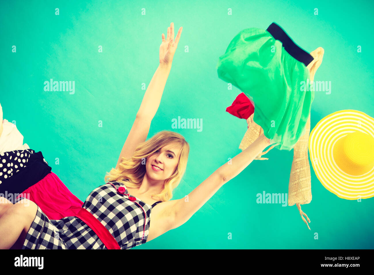 Woman throwing clothes in closet hi-res stock photography and images ...