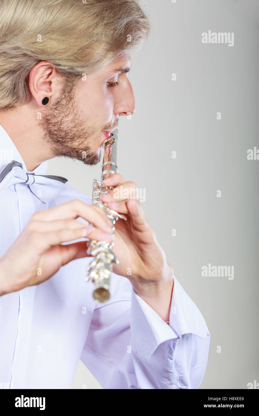 Flute music playing professional male flutist musician performer. Young ...