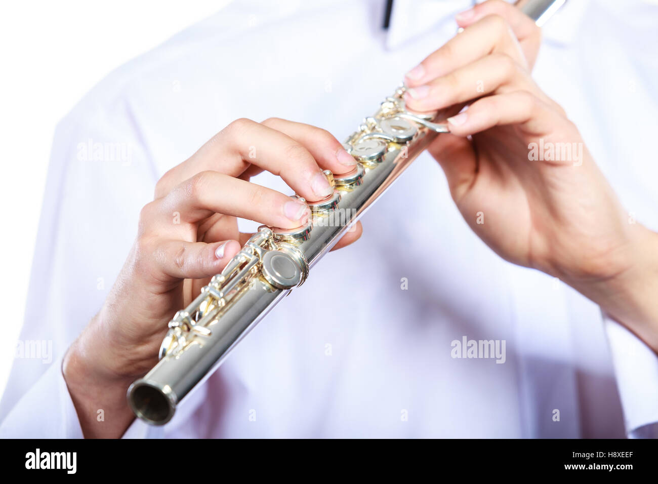 Hands of young man playing the flute. Male flutist musician performer ...