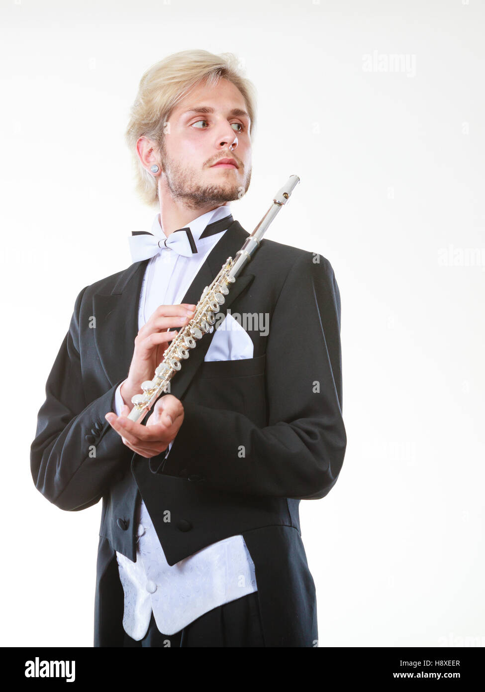 Classical music study concept. Male flutist musician performer playing ...