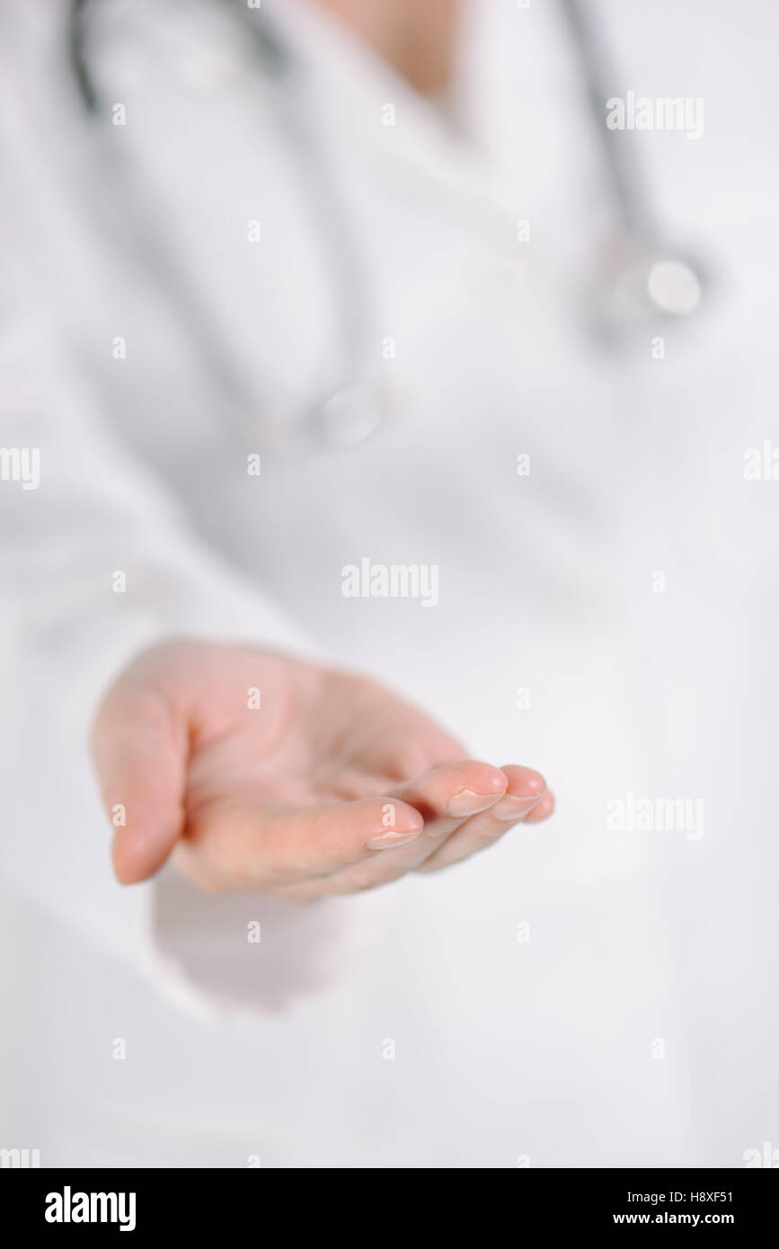 Female doctor lending hand requesting money for service, selective ...