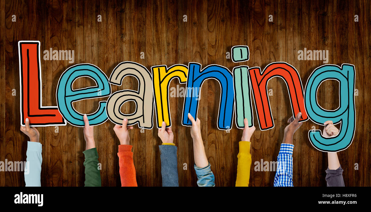 Group of Hands Holding Learning Word Concept Stock Photo - Alamy