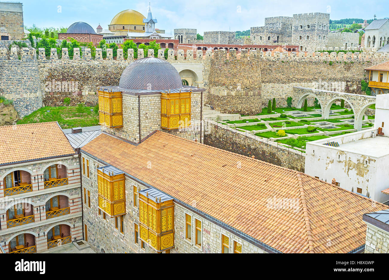 The stone rampart hides the renovated mosque with the golden dome and ...