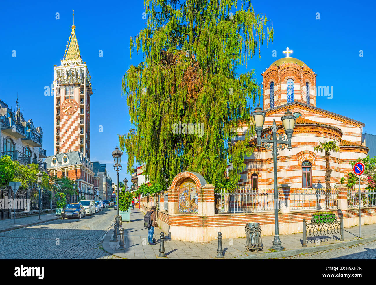 The Greek Orthodox St Nicholas Church neighbors with the slender clock ...