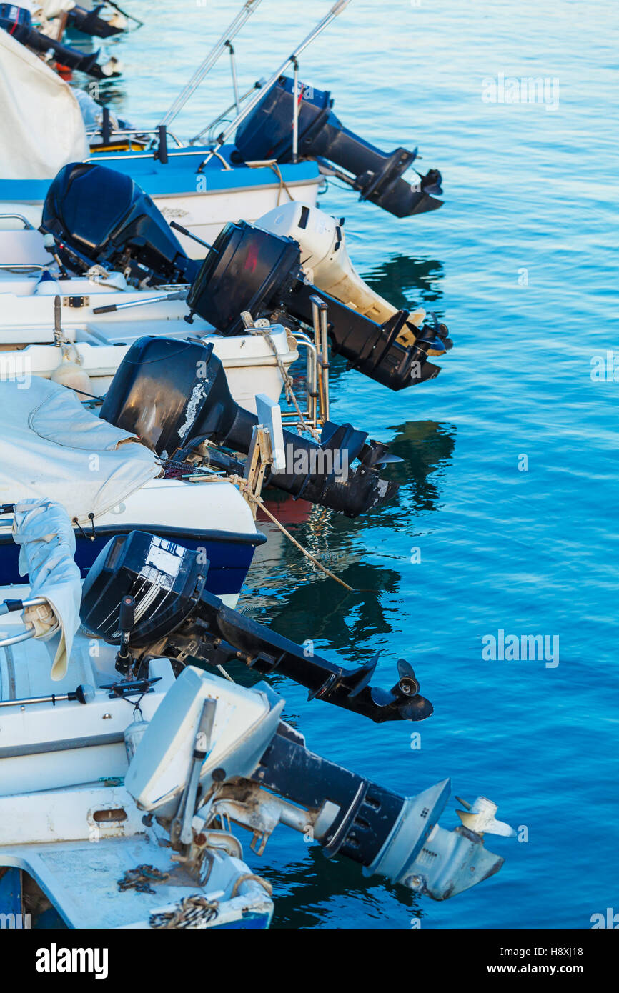 Modern Outboard engines on fishing boats Stock Photo - Alamy