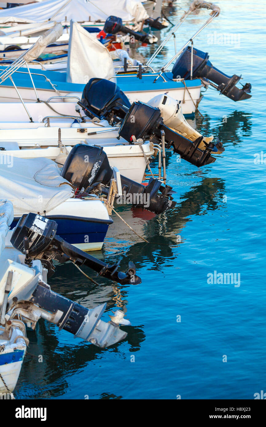 Modern Outboard engines on fishing boats Stock Photo - Alamy