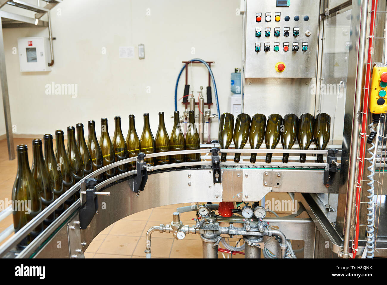 Bottling and sealing conveyor line at winery factory Stock Photo - Alamy