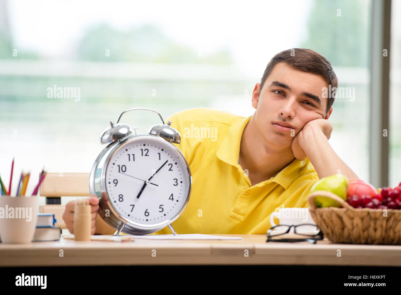Student missing deadlines for exam preparation Stock Photo - Alamy