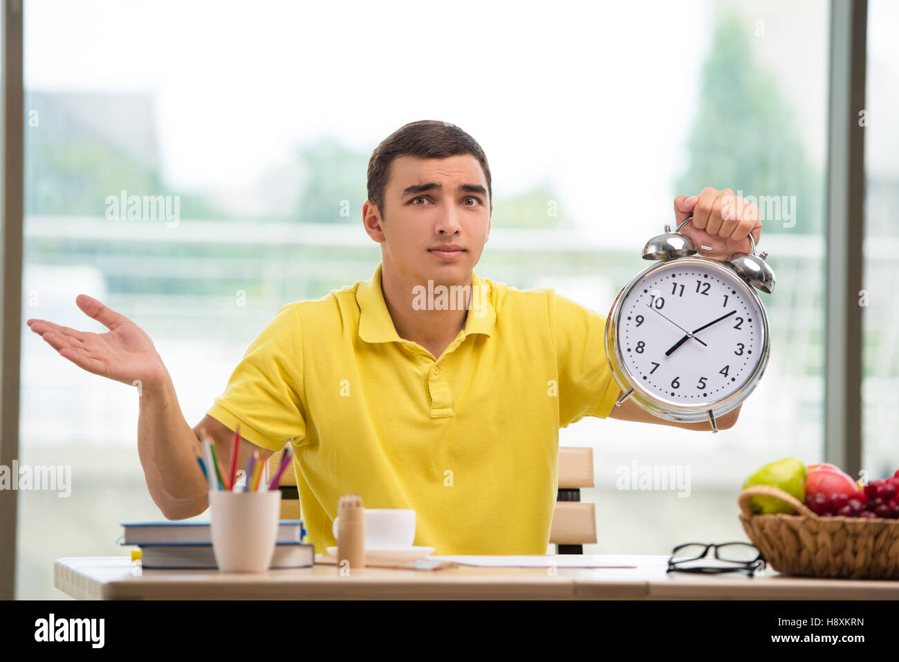Student missing deadlines for exam preparation Stock Photo - Alamy