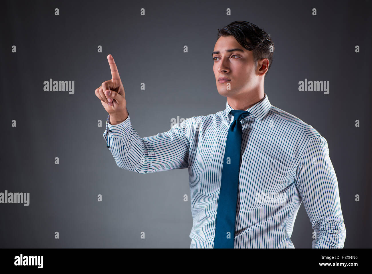 Handsome businessman pressing virtual buttons Stock Photo - Alamy Handsome businessman pressing virtual buttons Stock Photo - Alamy
