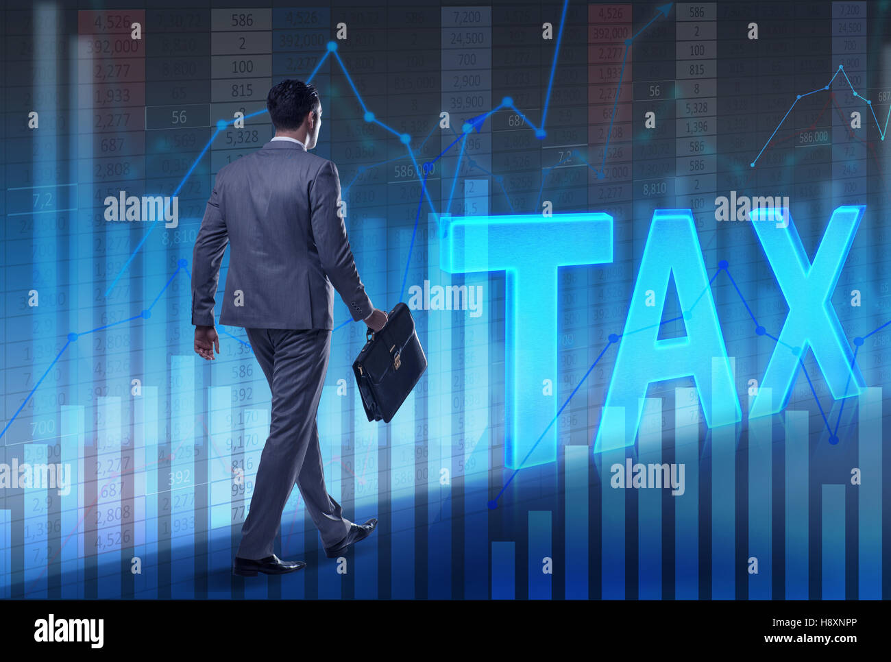 Man walking towards tax letters Stock Photo - Alamy