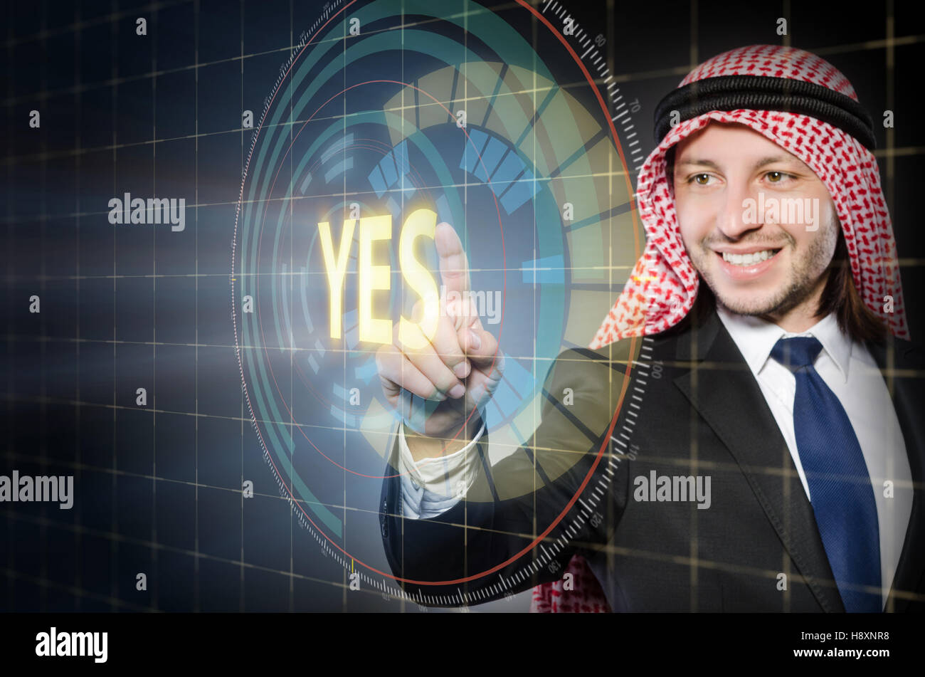 Arab man pressing yes button Stock Photo - Alamy