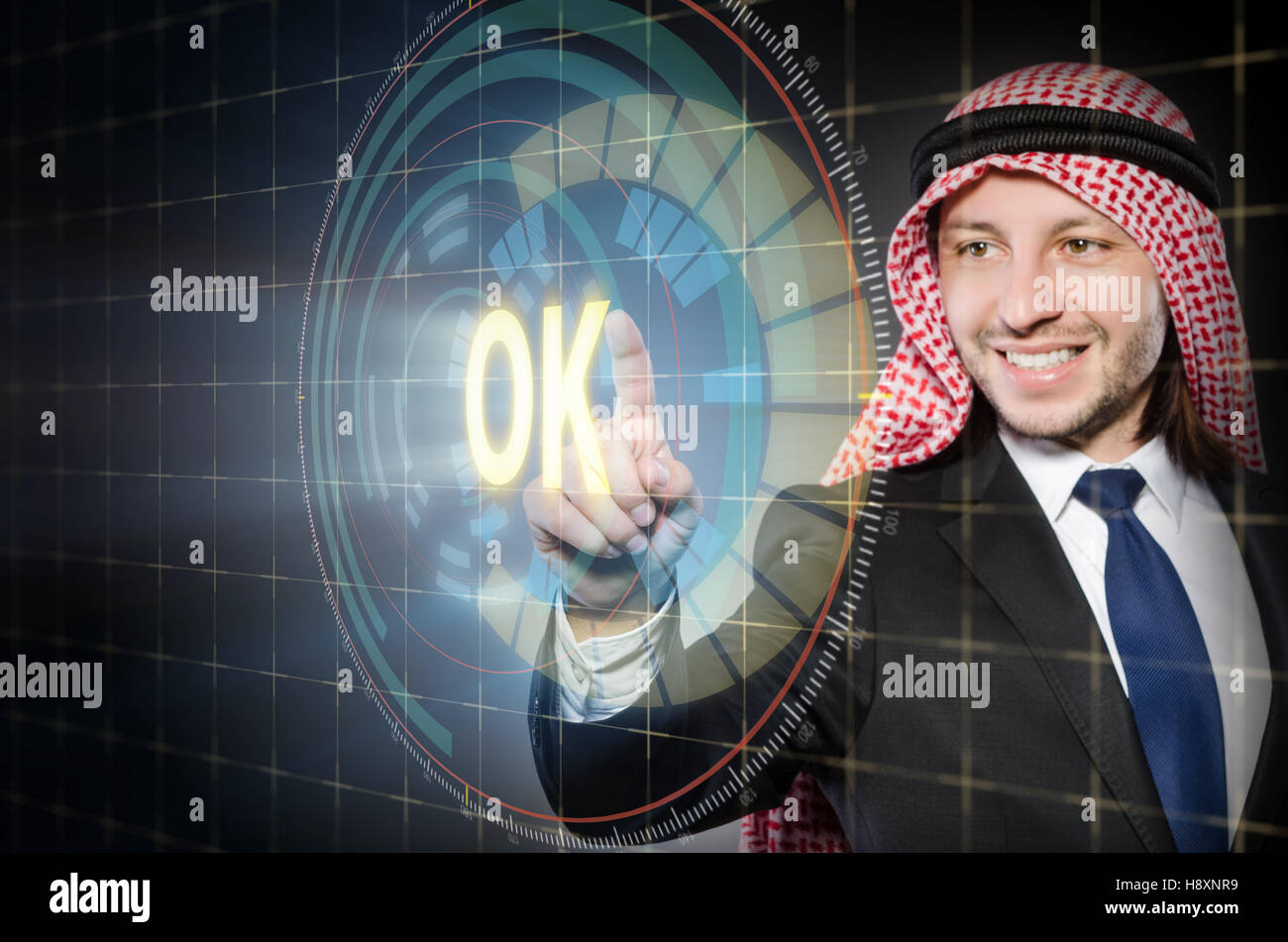 Arab man pressing ok button Stock Photo - Alamy
