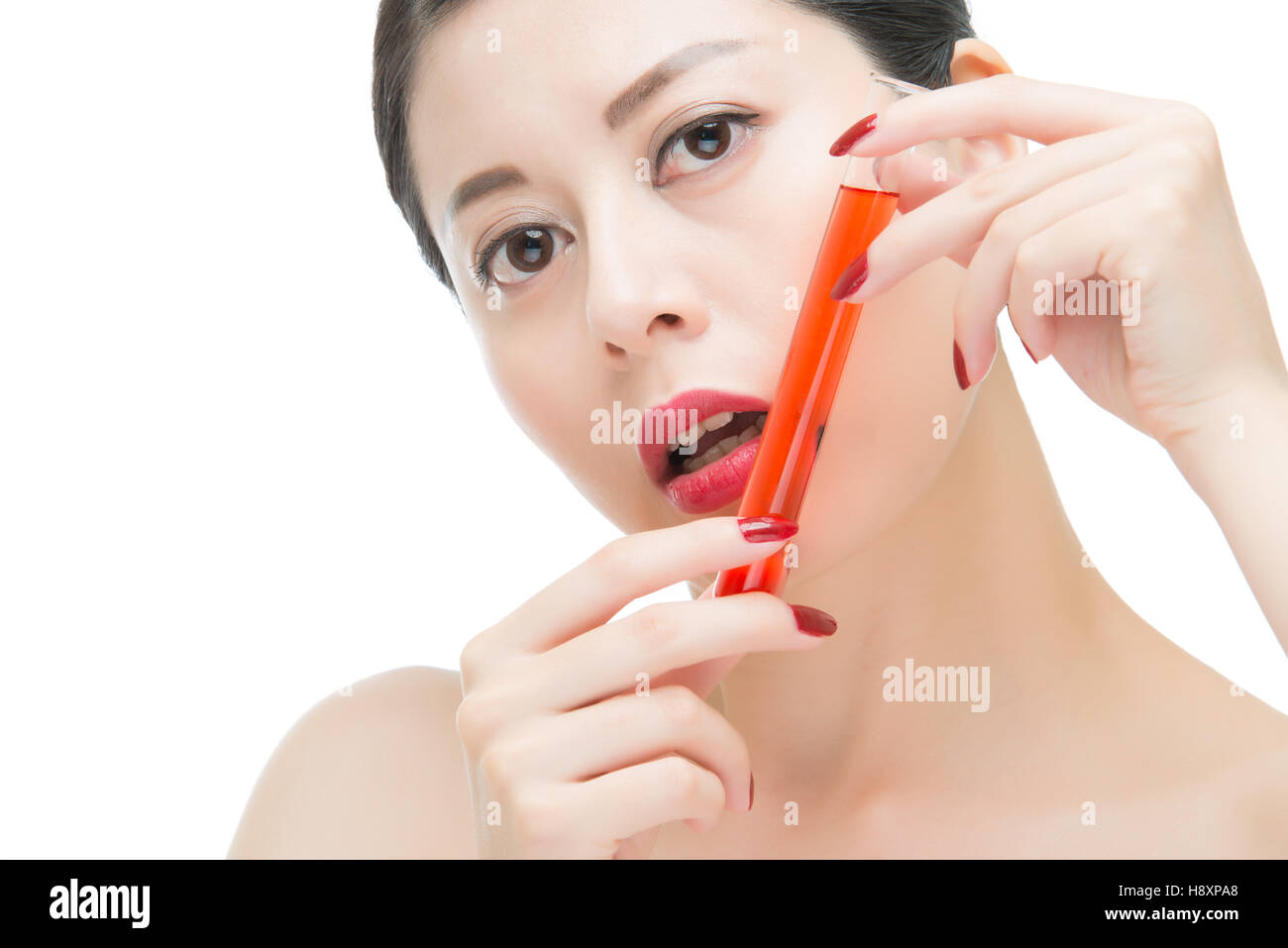 beauty asian woman red lips nail and holding lab tube with red ...