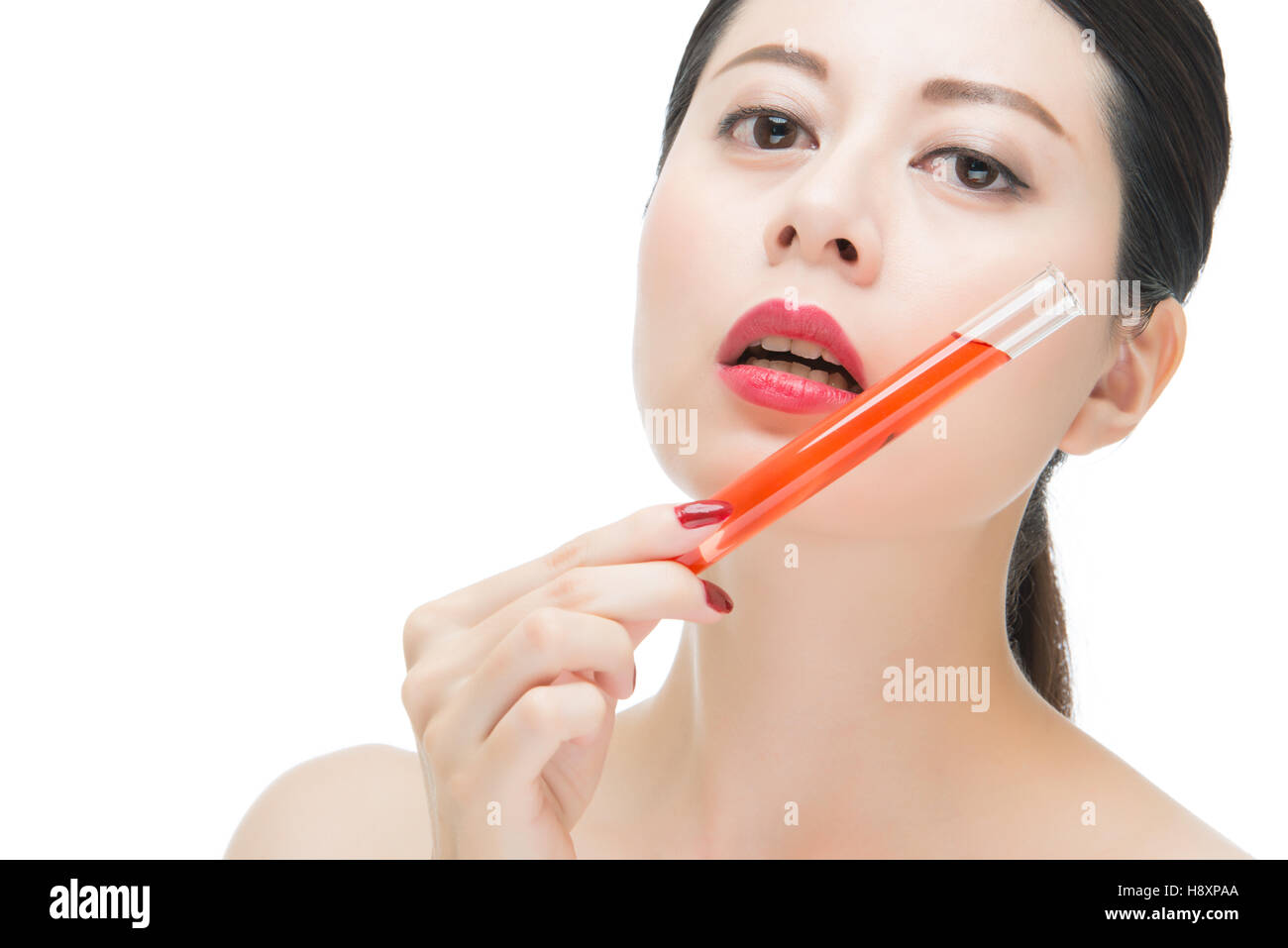 beauty asian woman red lips nail and holding lab tube with red ...