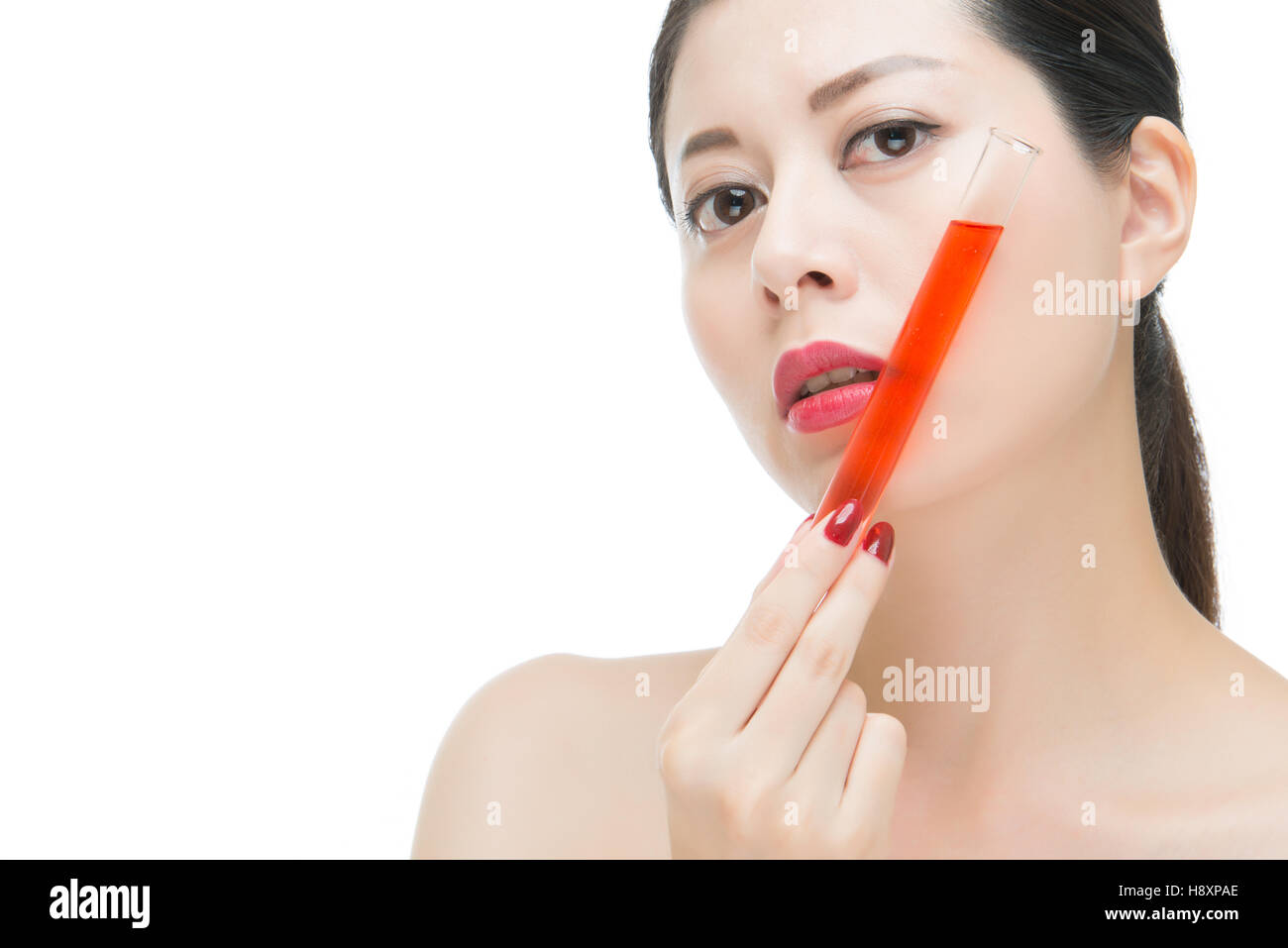 beauty asian woman red lips nail and holding lab tube with red ...