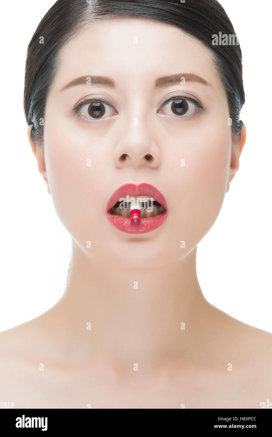 beautiful fashion asian woman bite medicine pill for medical treatment ...
