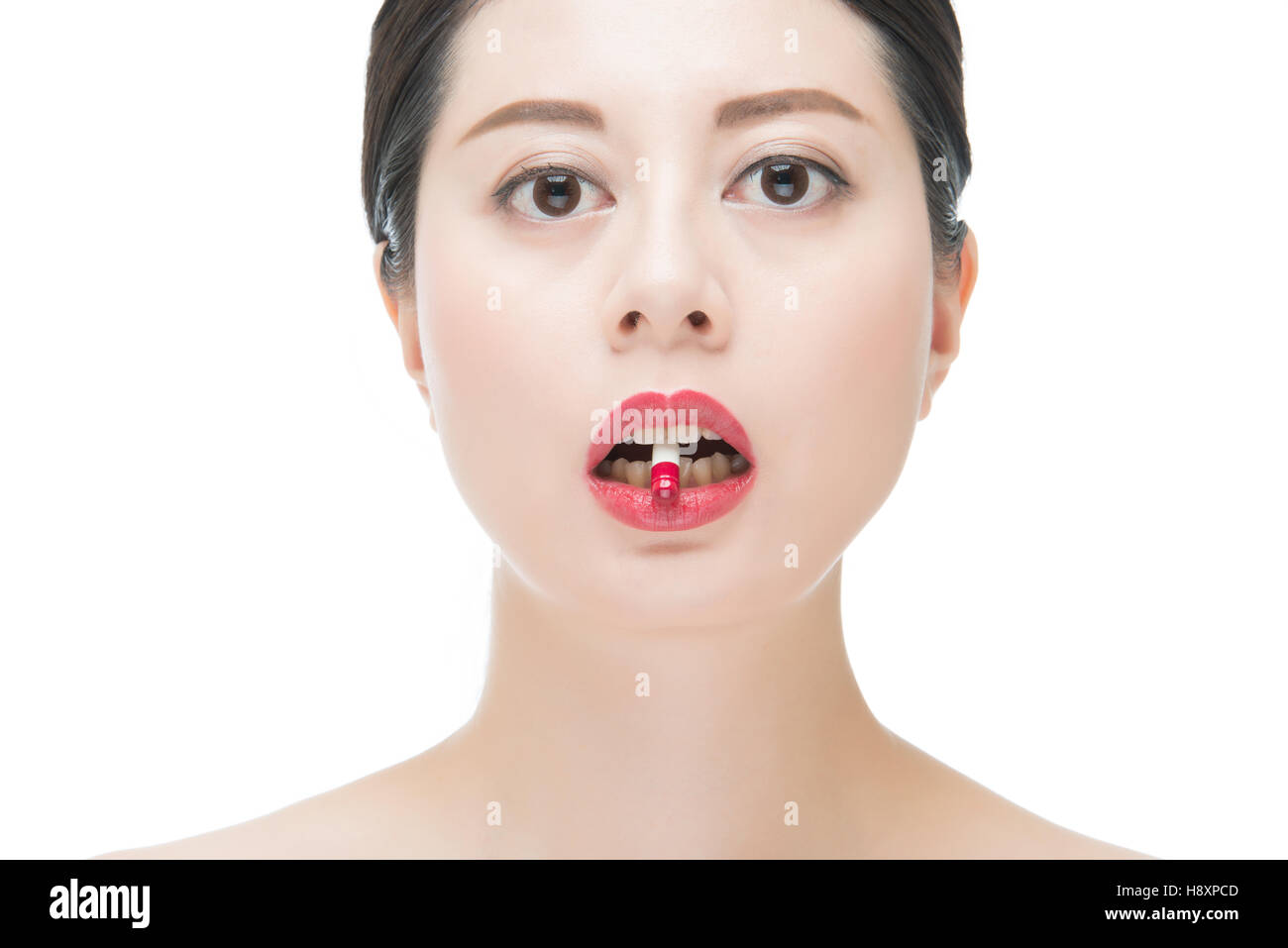 beautiful fashion asian woman bite medicine pill for medical treatment ...