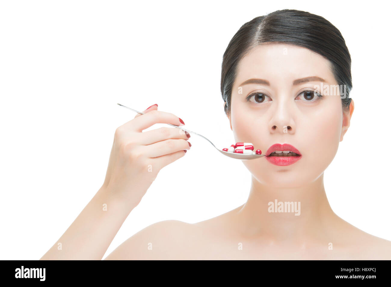 asian woman use spoon taking numerous of medicine pill, isolated on ...