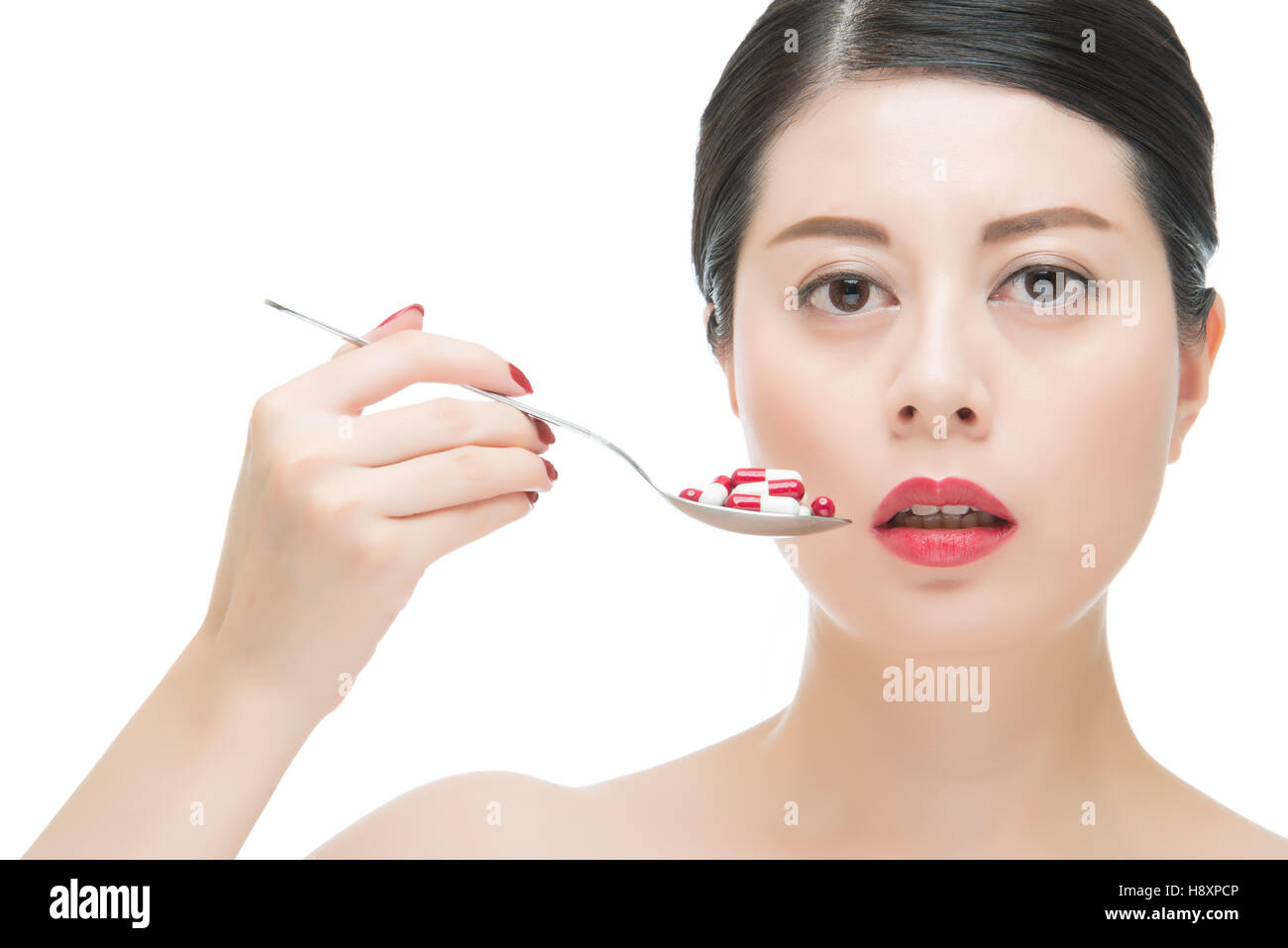 asian woman use spoon taking numerous of medicine pill, isolated on ...