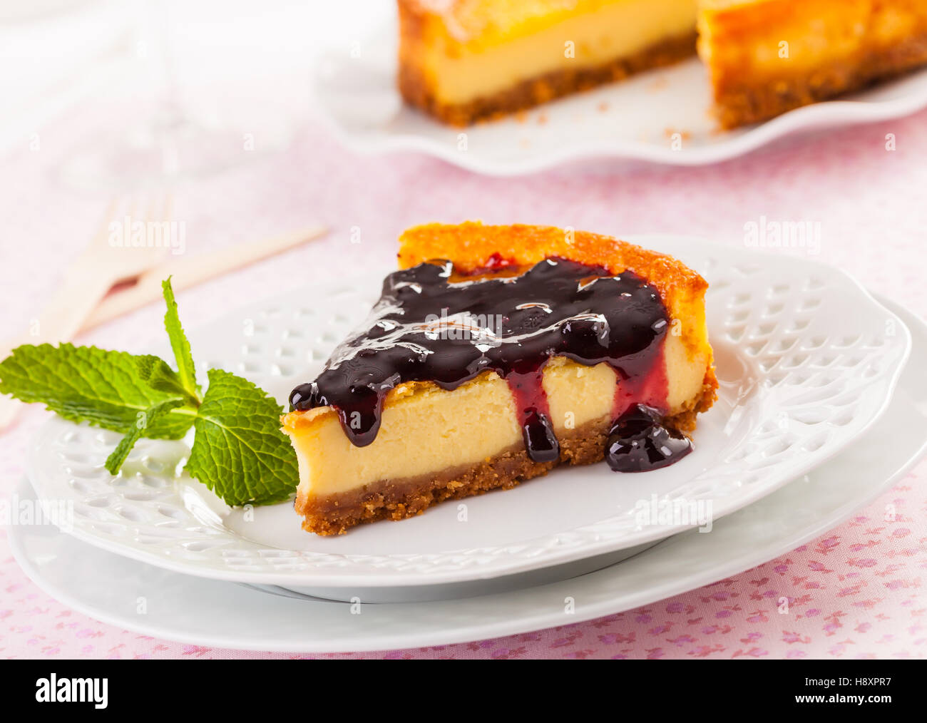 A portion of New York cheesecake on a plate Stock Photo - Alamy