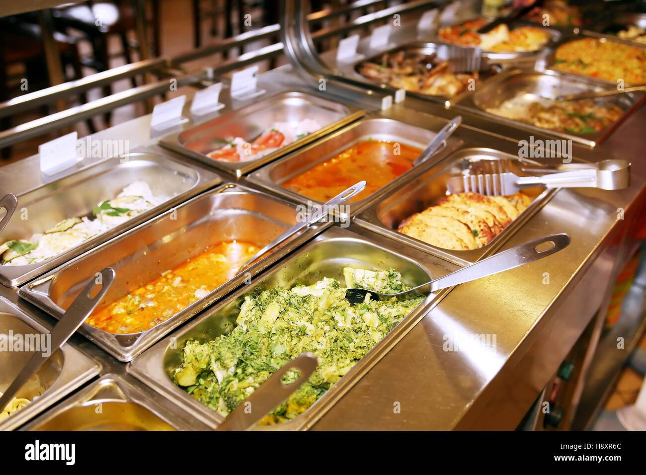 Commercial kitchen. Set of various food for sale on counter in cafe ...