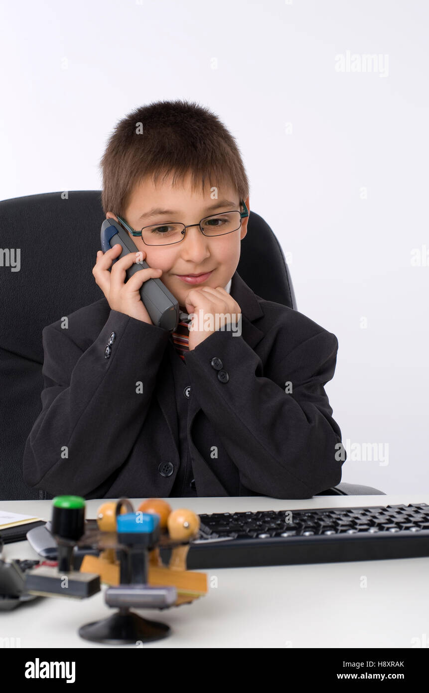Little businessman in office Stock Photo - Alamy