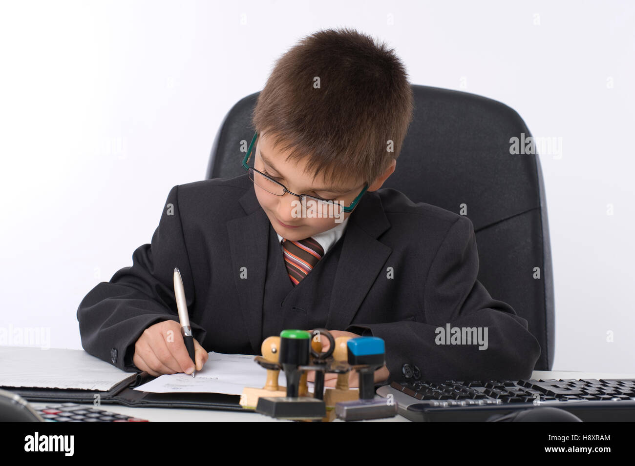 Little businessman in office Stock Photo - Alamy