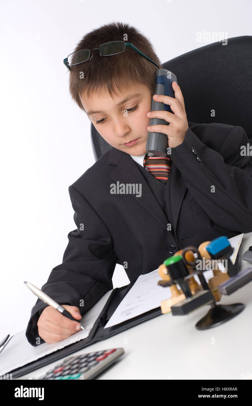 Little businessman in office Stock Photo - Alamy