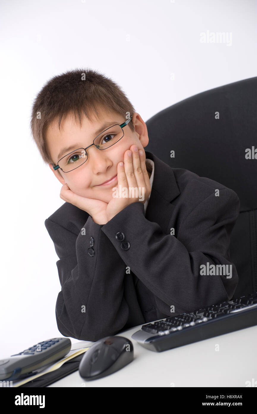 Little businessman in office Stock Photo - Alamy
