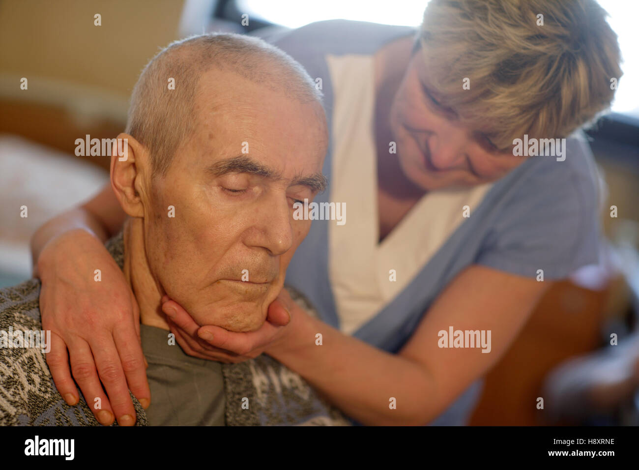 Nursing home, elderly man with a nurse Stock Photo - Alamy
