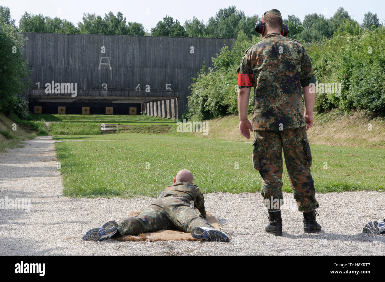 Soldiers shooting during a shooting competition at a shooting range ...