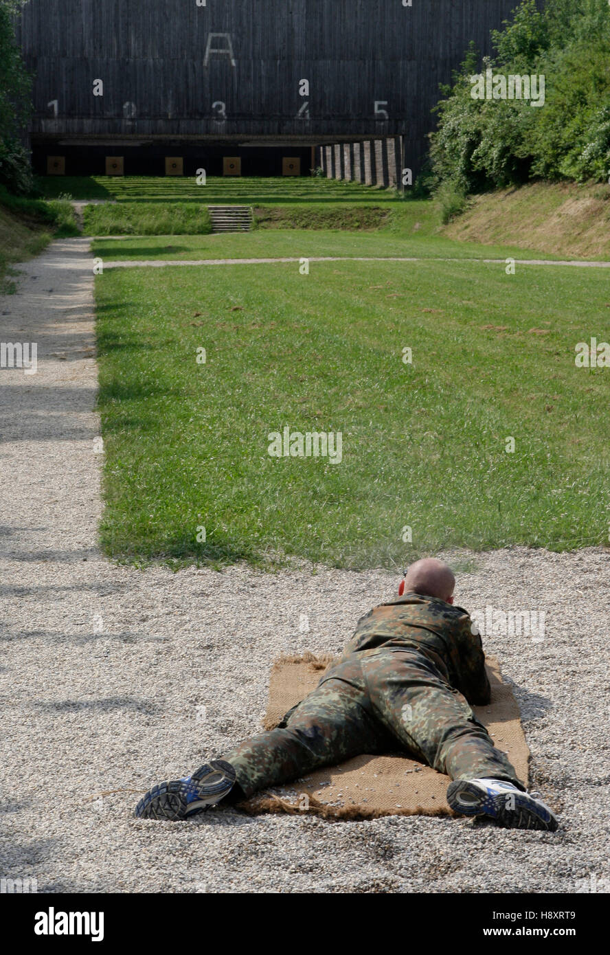 Soldier shooting during a shooting competition at a shooting range ...