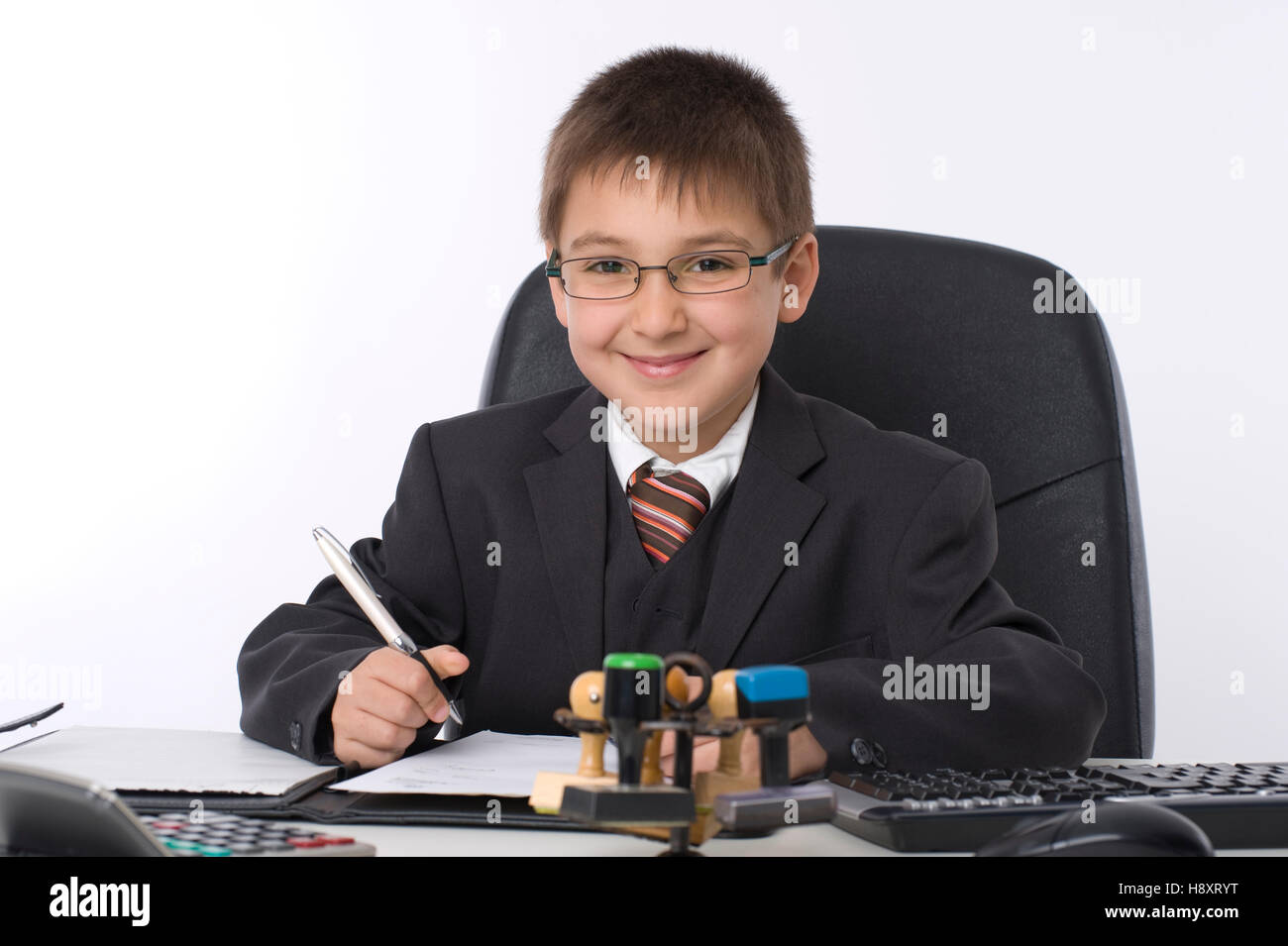 Little businessman in office Stock Photo - Alamy