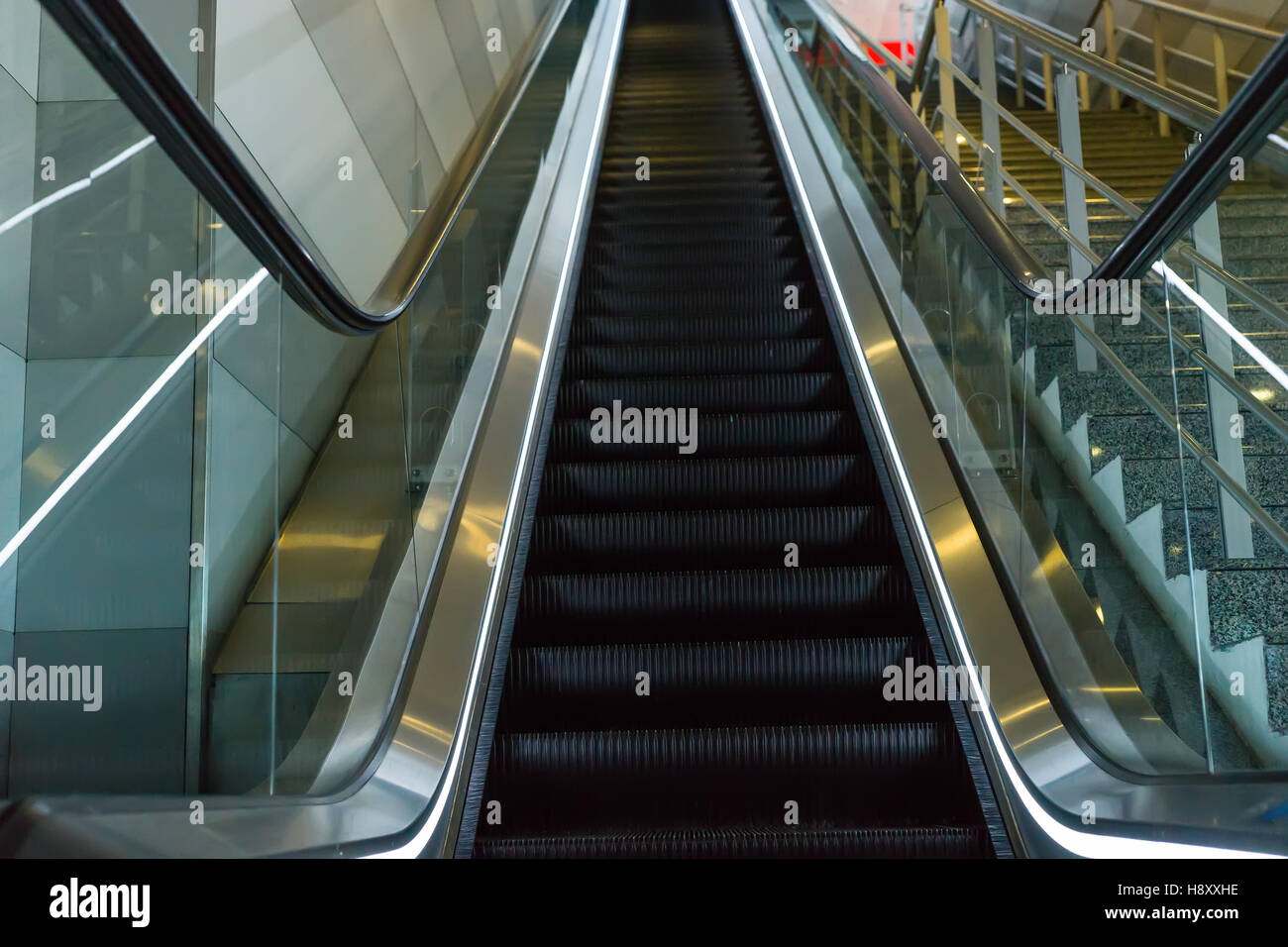Close up of empty moving escalator at the airport or shopping mall ...