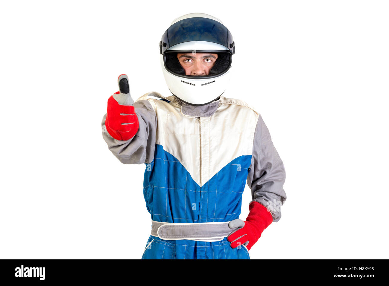 Racing driver posing with helmet isolated in white Stock Photo - Alamy