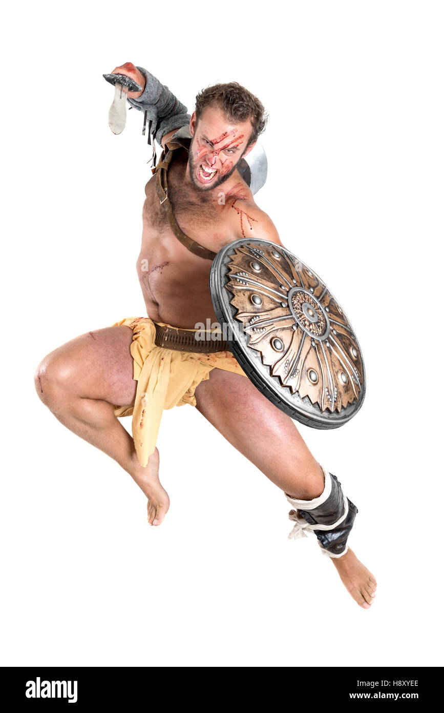 Ancient warrior or Gladiator jumping isolated in a white background ...