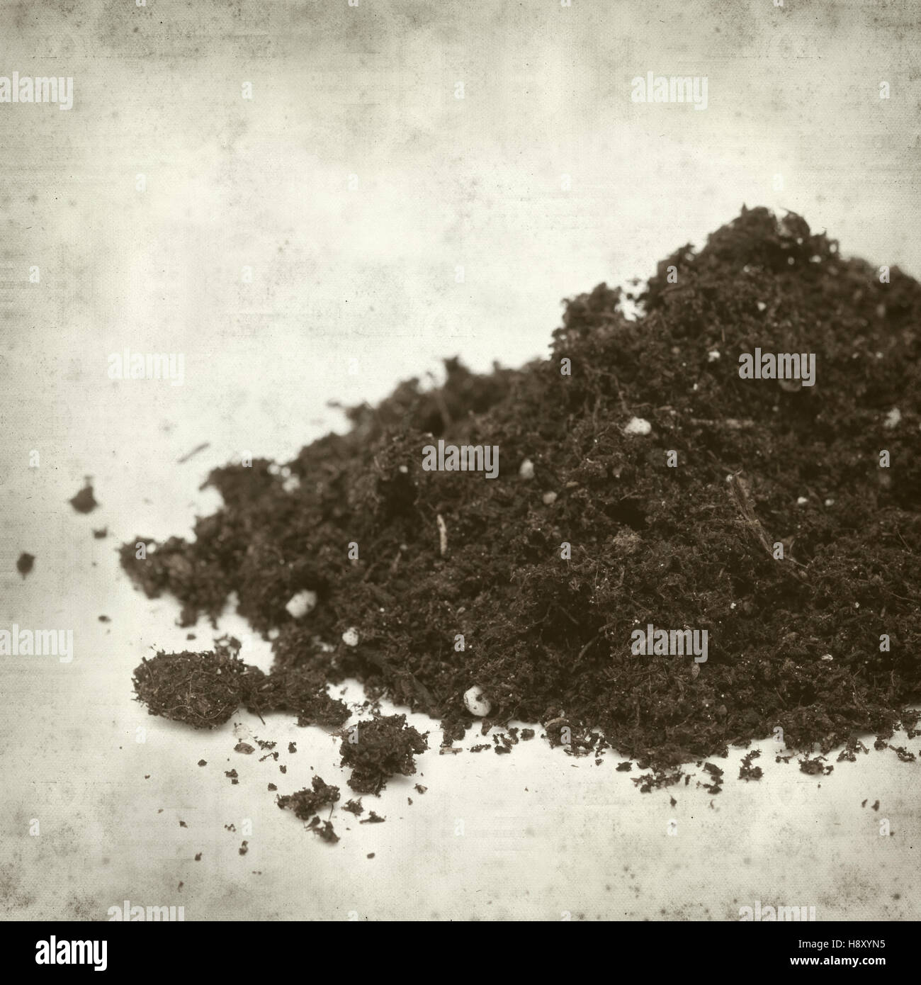 textured old paper background with small heap of compost Stock Photo ...