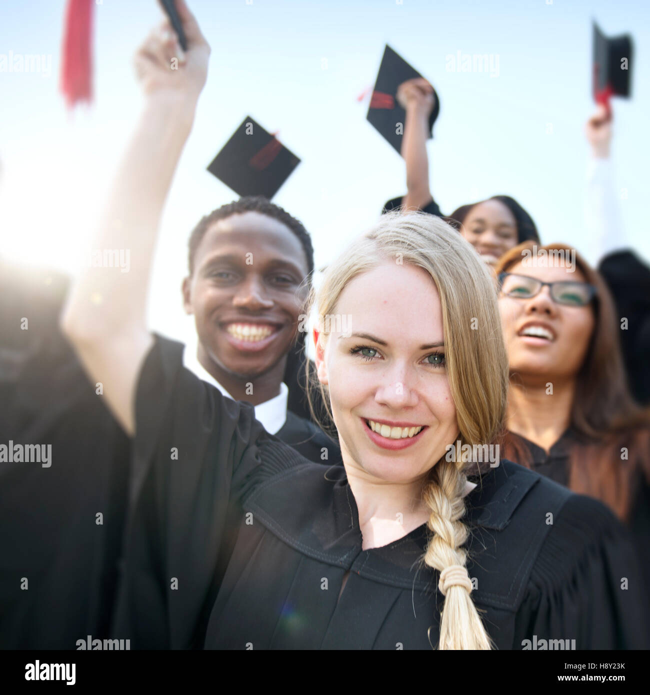 Graduation cap throwing hands hi-res stock photography and images - Alamy