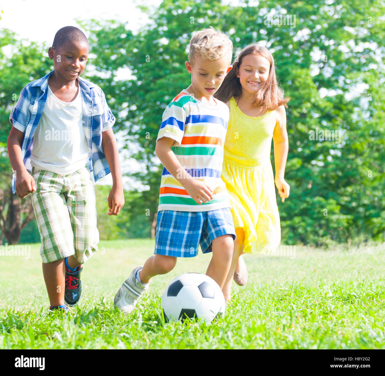 Children Playing Football Holidays Summer Concept Stock Photo - Alamy