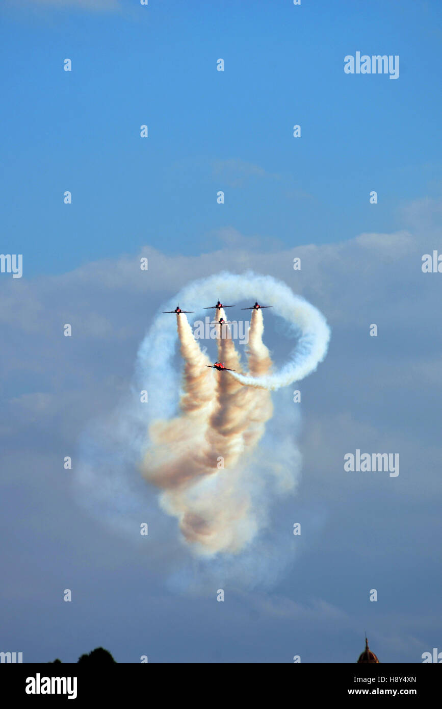 Royal Air Force aerobatic display planes, Red Arrows, fly in cloudy ...