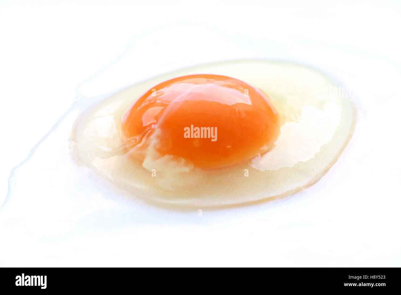 raw egg yolk isolated Stock Photo - Alamy